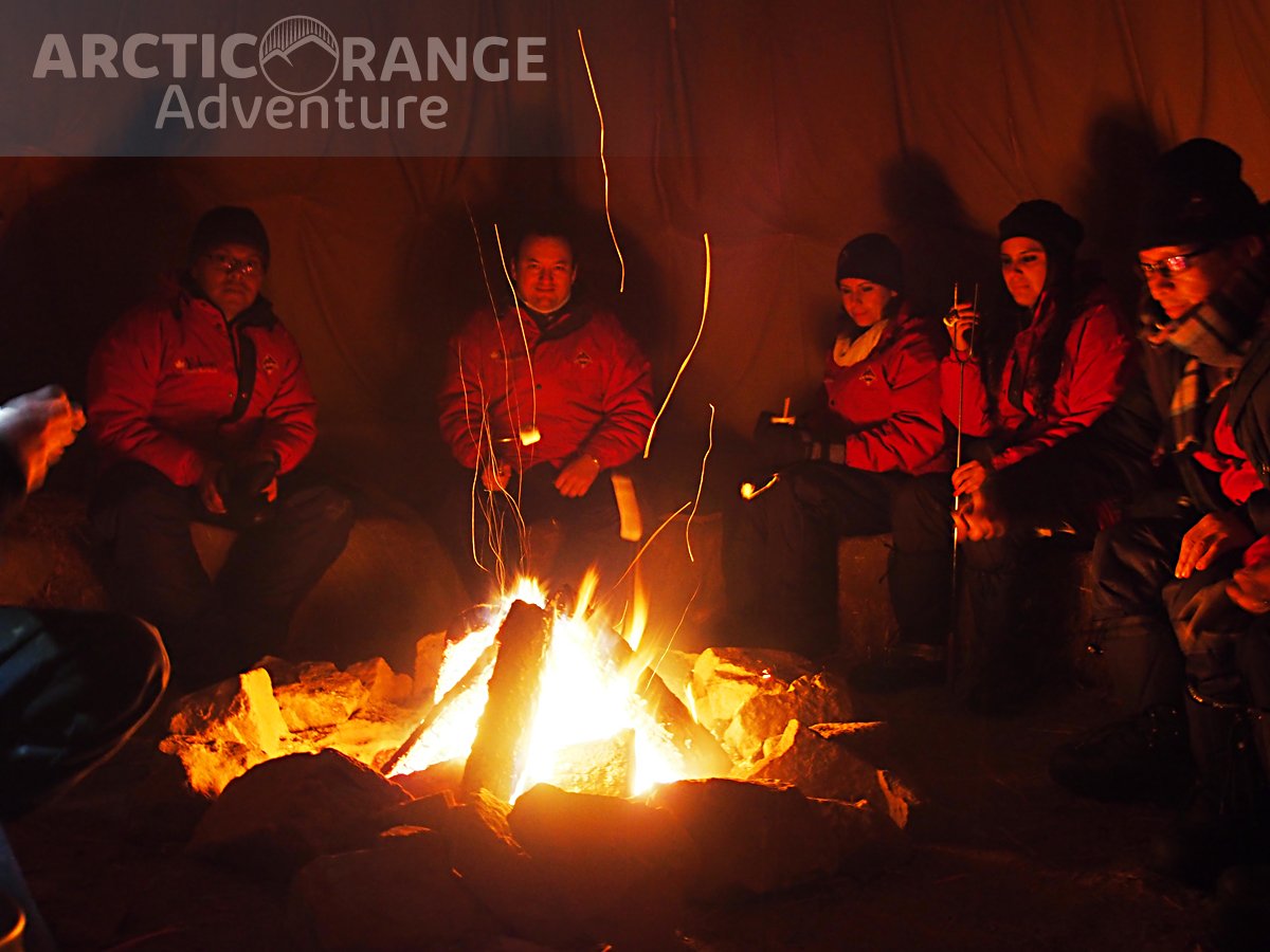 Group enjoys the campfire | Arctic Range Adventure