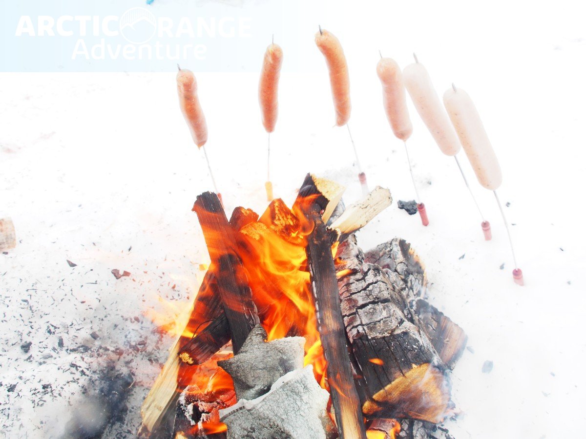 Roasting sausages on the campfire | Arctic Range Adventure
