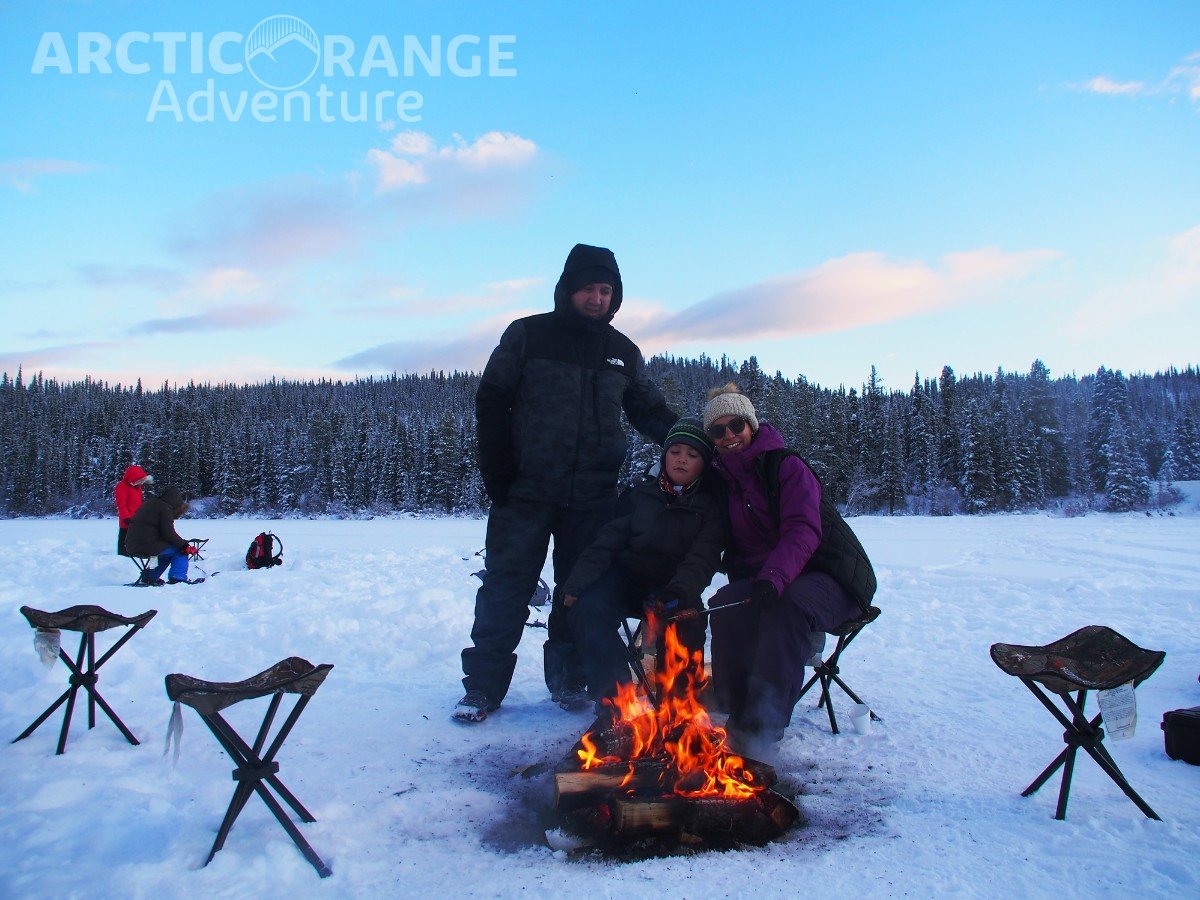 Keeping warm around the campfire | Arctic Range Adventure